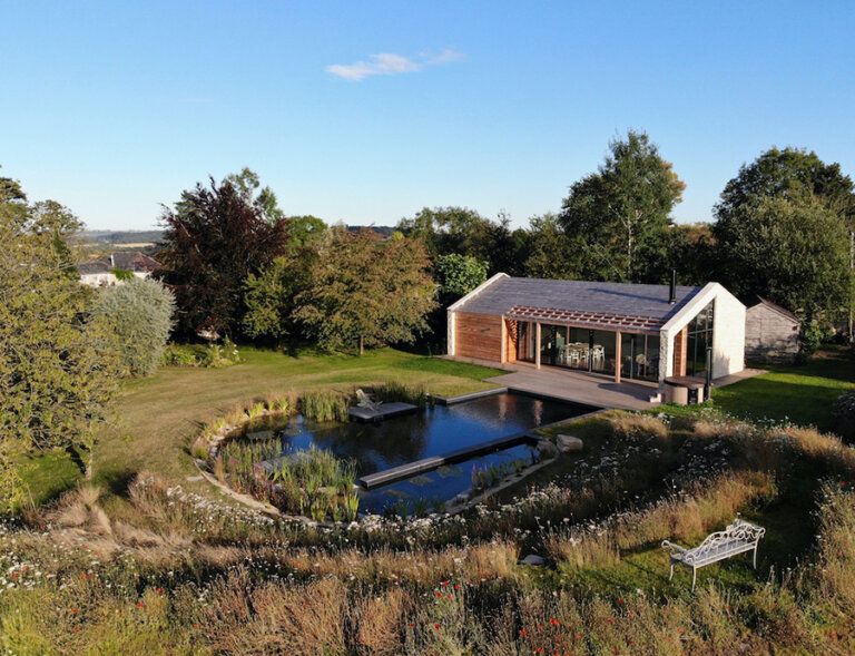 A pool house and natural pool in England